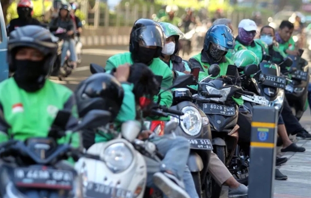 Indonesia strengthens online motorcycle taxi drivers protection